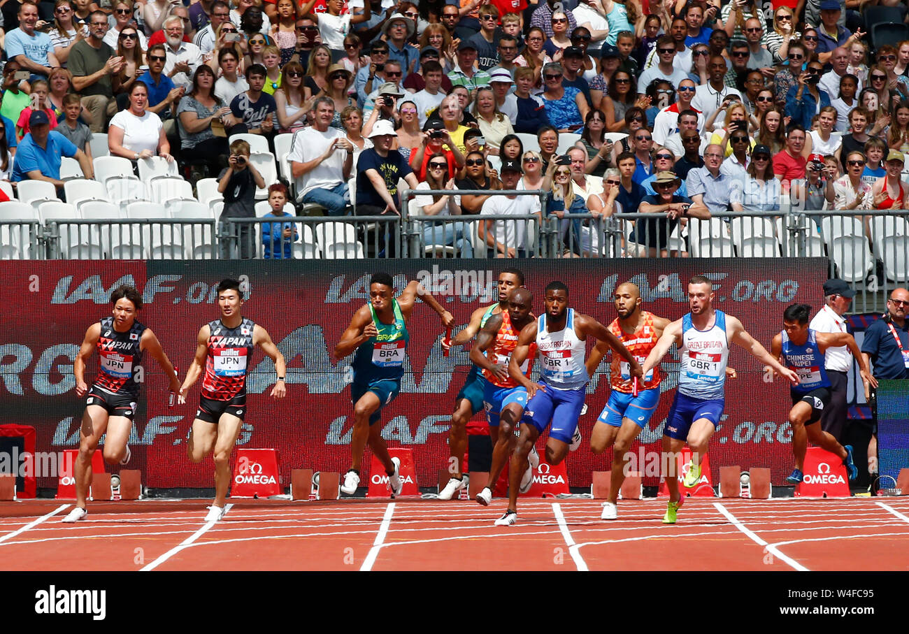 LONDON, ENGLAND. JULY 21: L-R Yoshihide Kiryu charging baton with ...