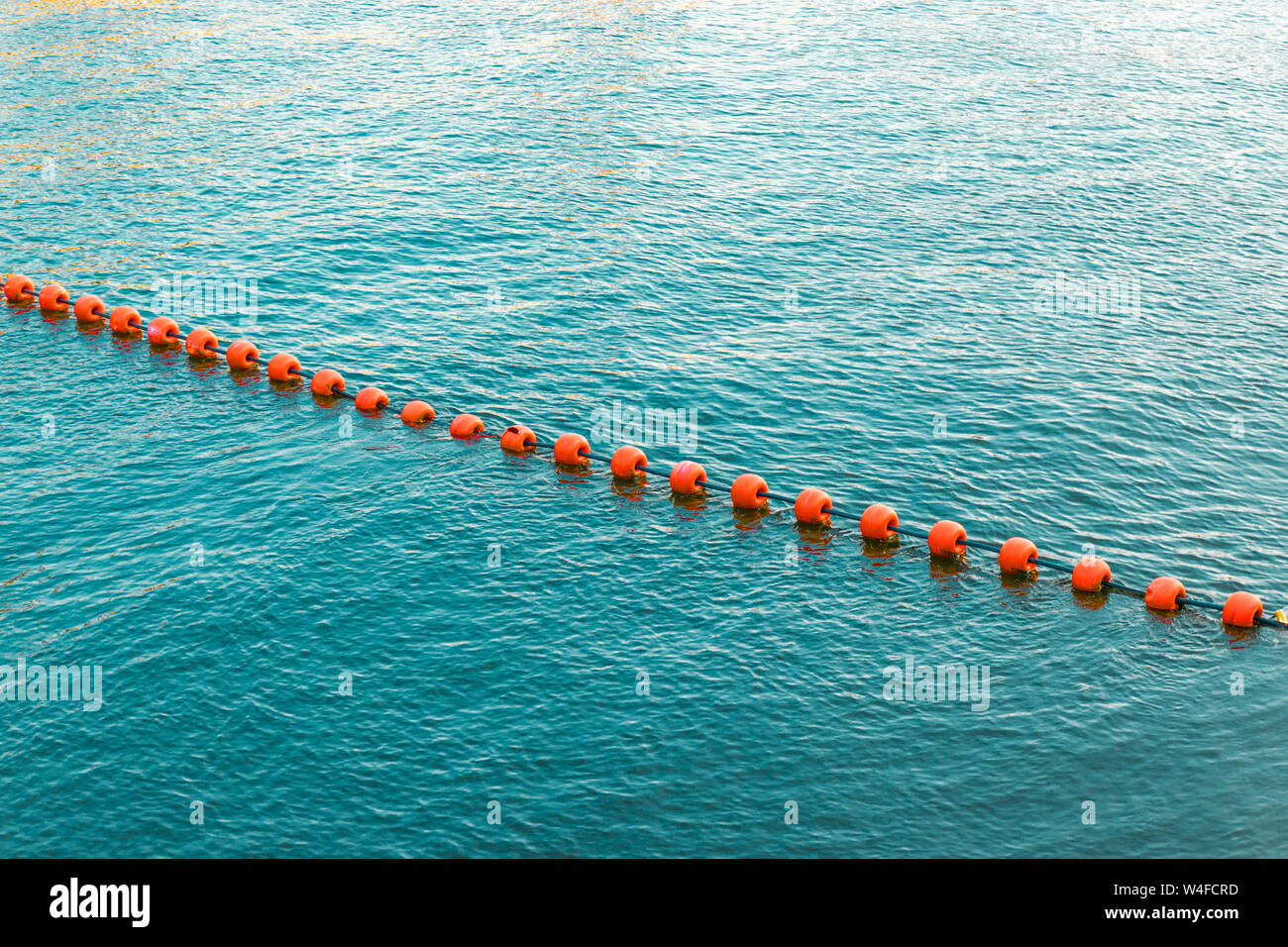 Orange buoys in the sea. Separation buoys in the river for safe ...