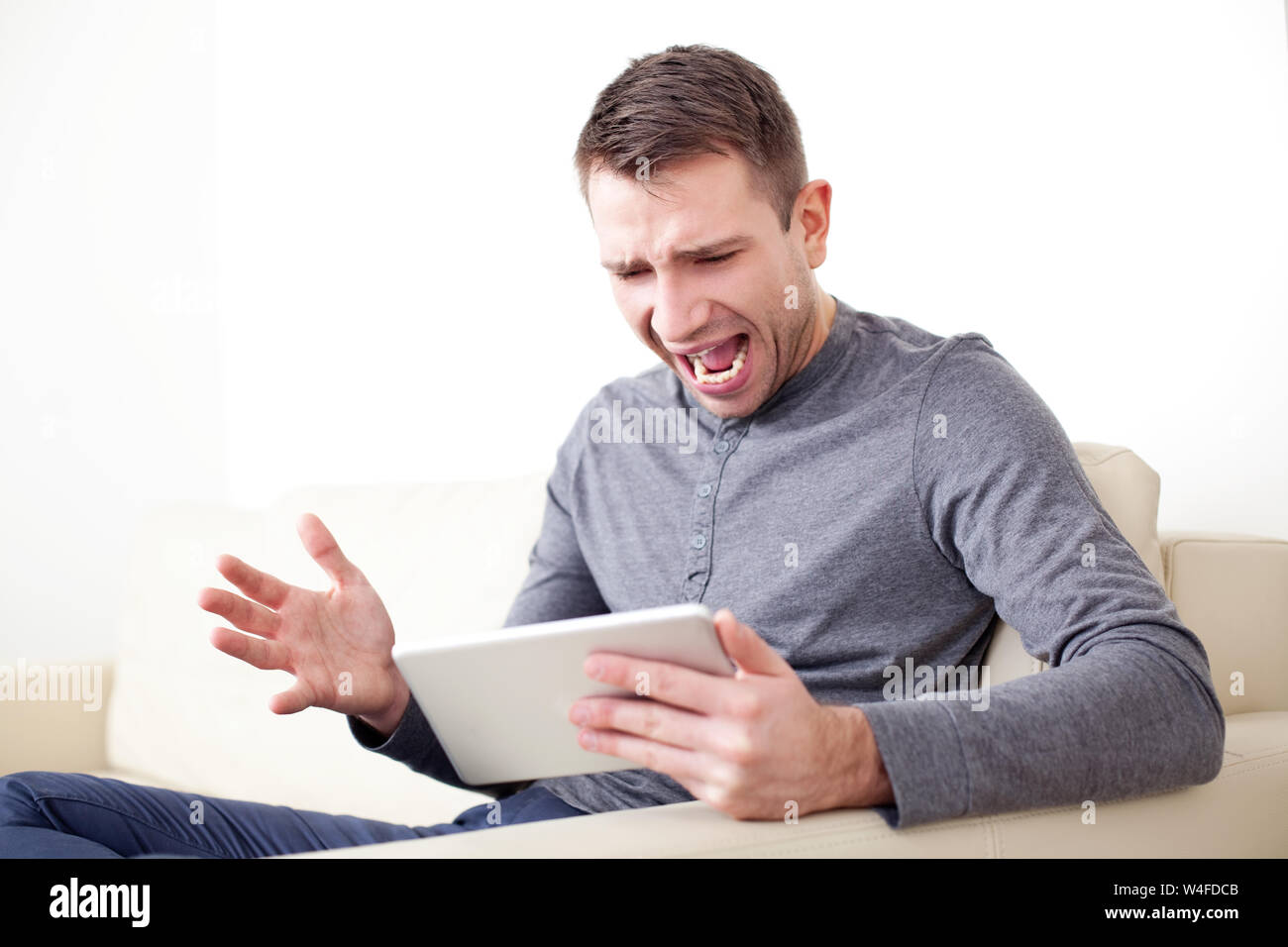 Mad sitting hi-res stock photography and images - Alamy