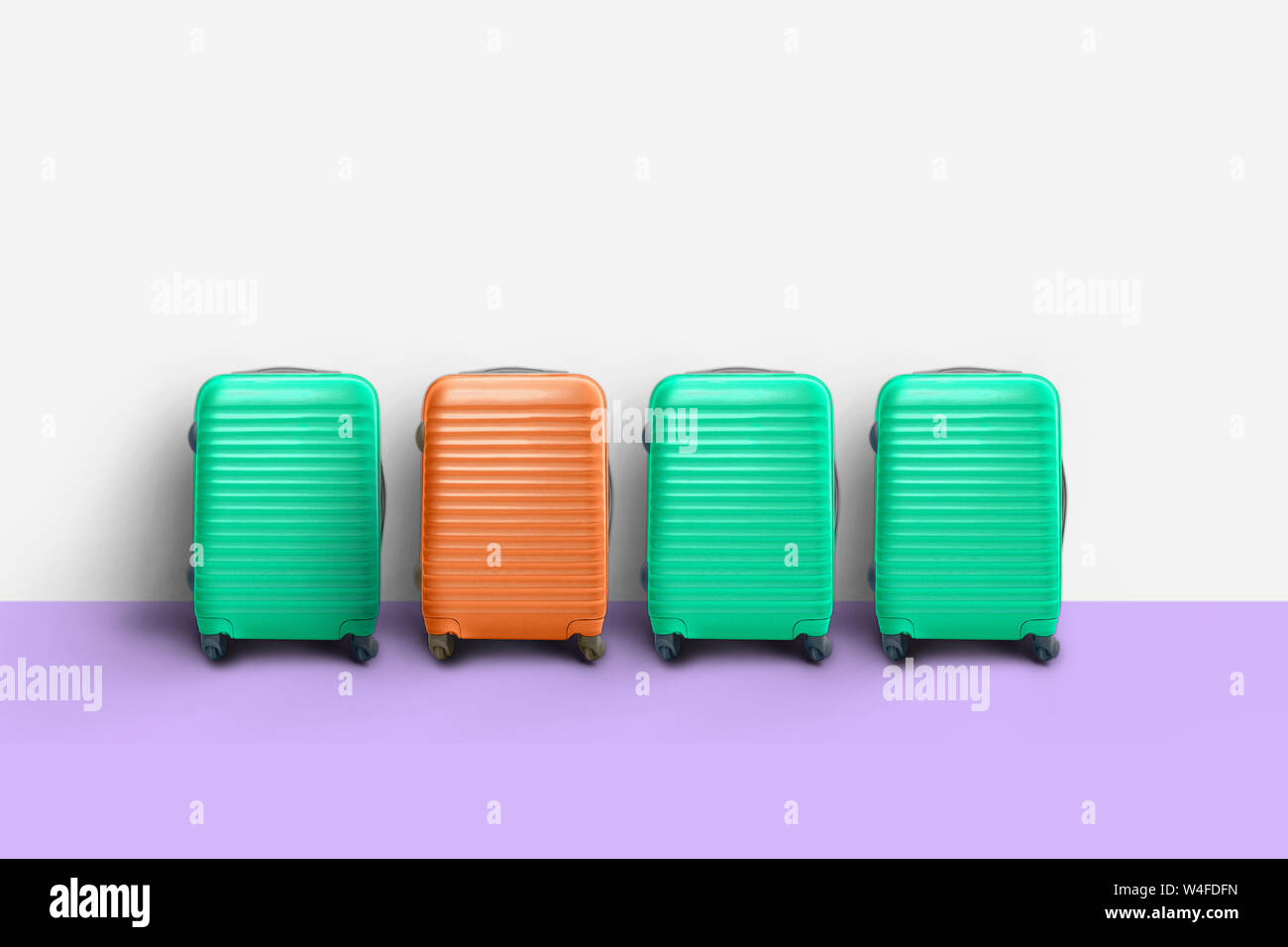 Colorful set of suitcases on pastel colors on pastel background ...