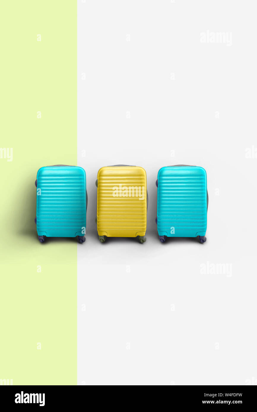 Colorful set of suitcases on pastel colors on pastel background ...
