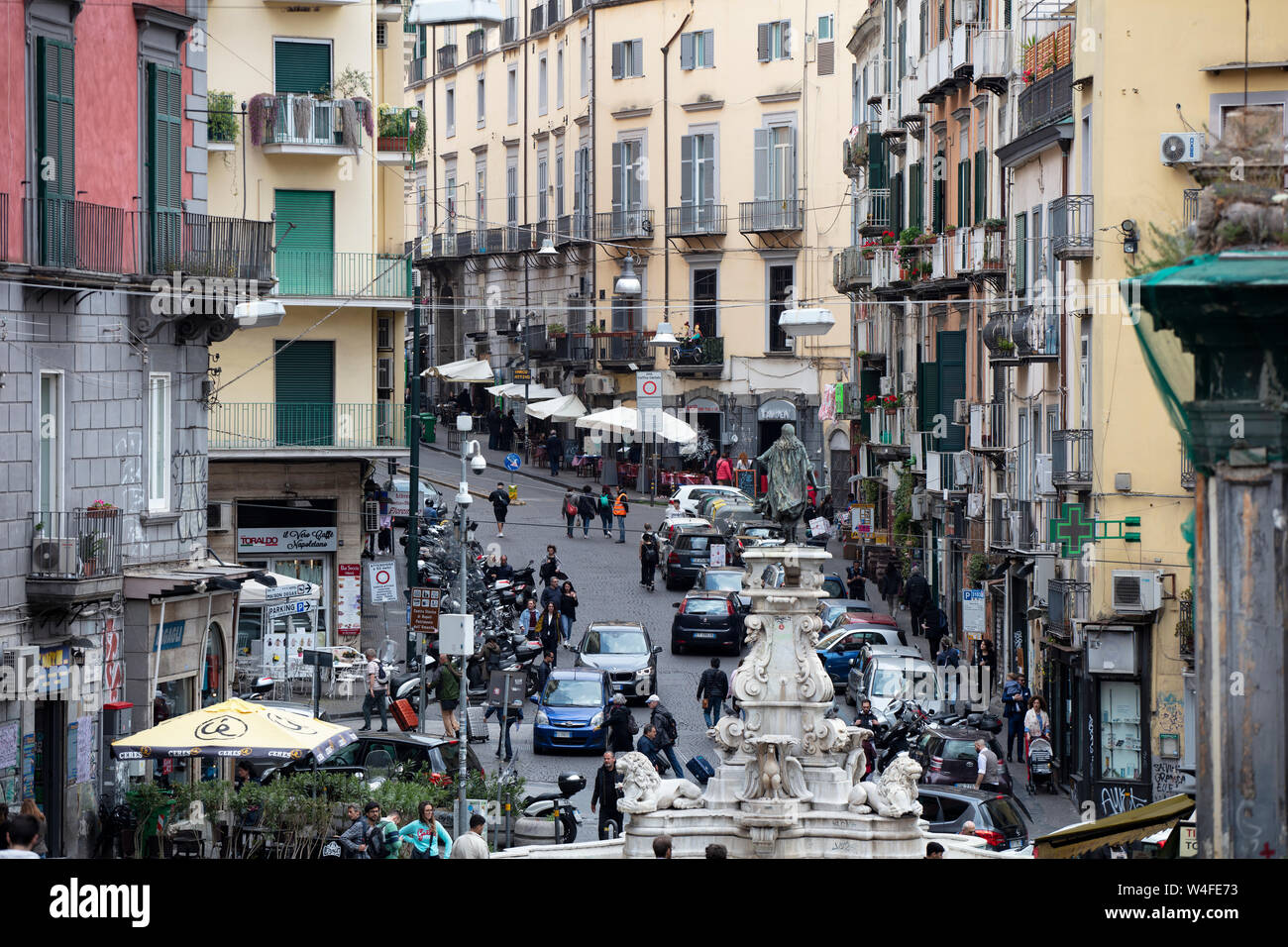 A typical street scene in the historic centre of Naples with a baroque ...