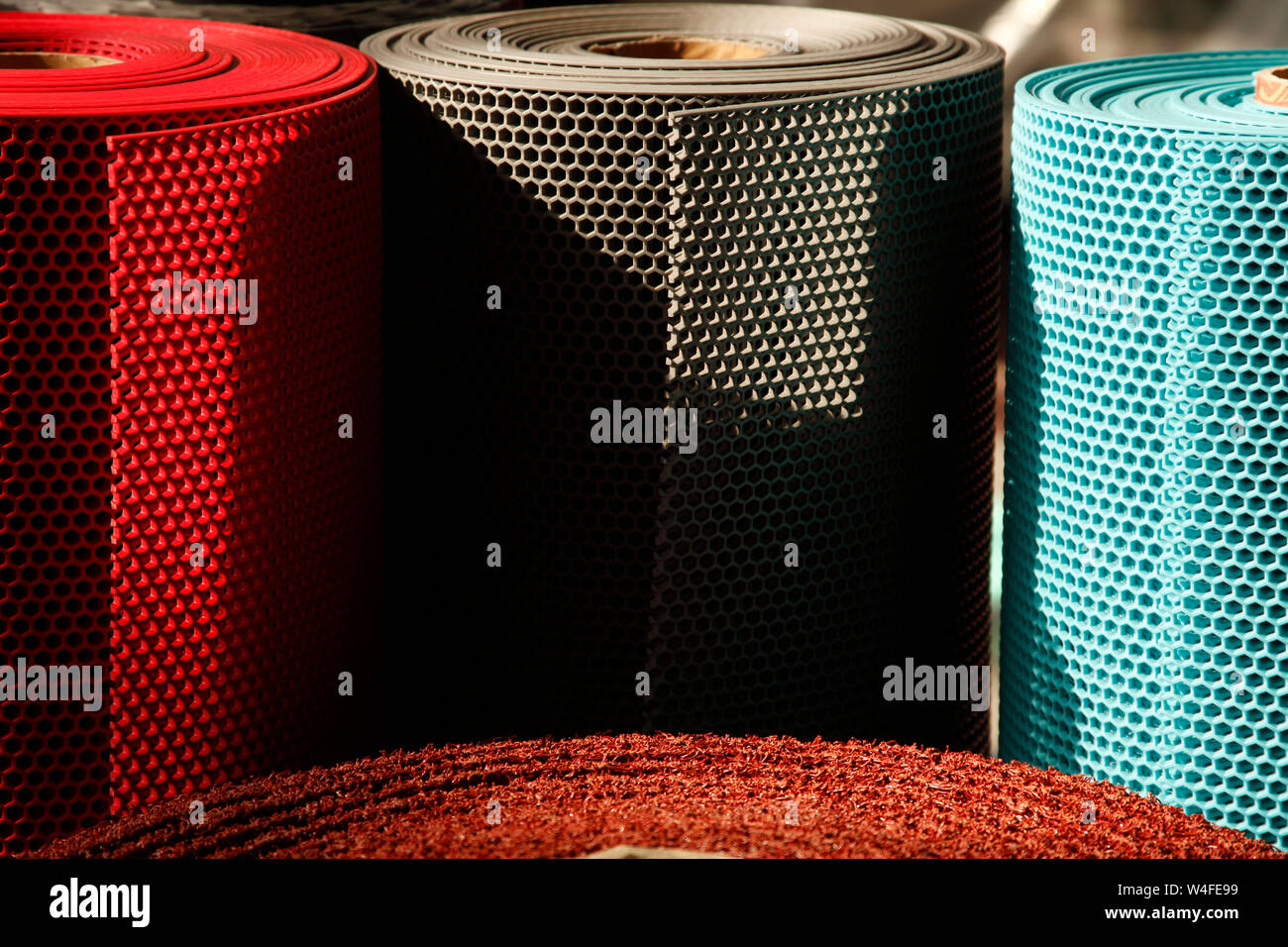 Colorful and perforated plastic grid Stock Photo - Alamy
