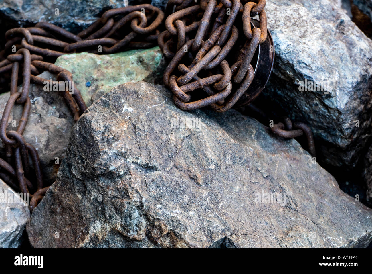 Rusty chain on on gray stones. The symbol of slave labor Stock Photo ...