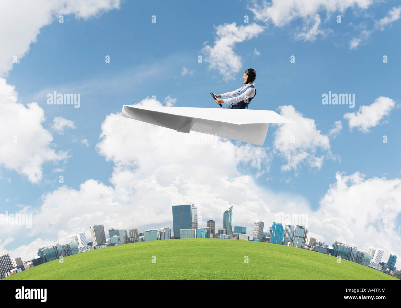 Aviator driving paper plane above business center. Pilot in leather ...