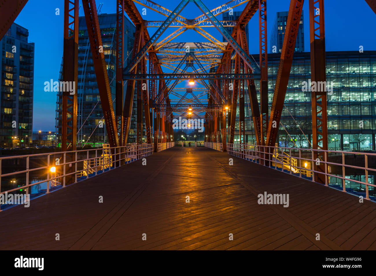The Detroit Bridge at night, Salford Quays, Manchester, UK. On the left ...
