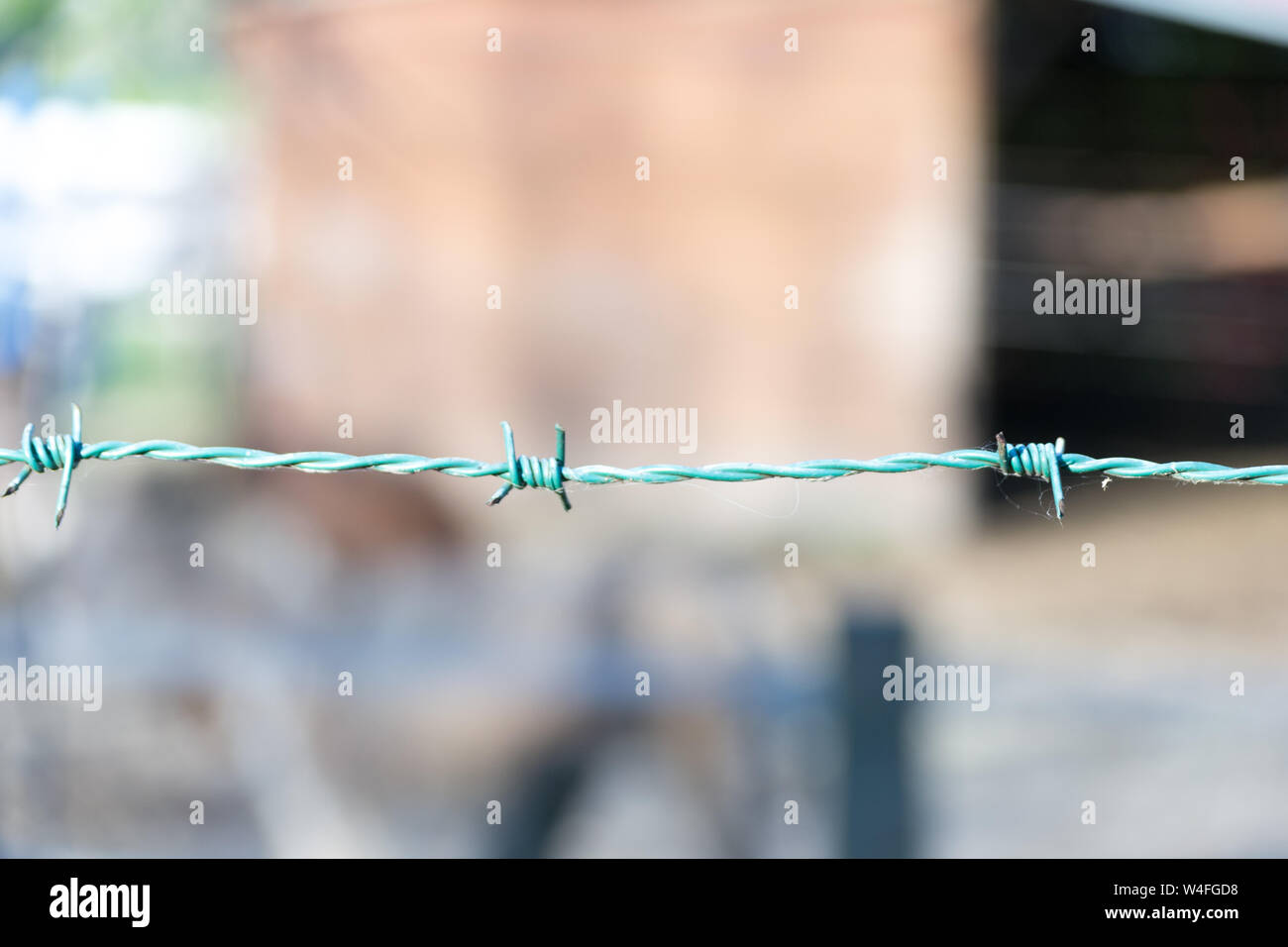 Old barbed wire on pole hi-res stock photography and images - Alamy