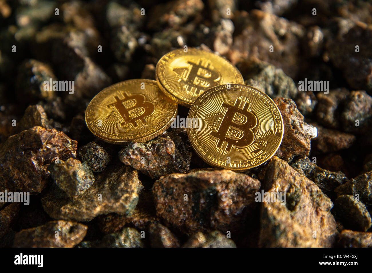 Vertical top view of a close-up of a bitcoin stack of gold coins ...