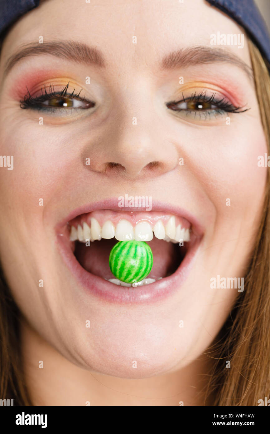 Funky people concept. Attractive girl chewing gum. Young woman has ...