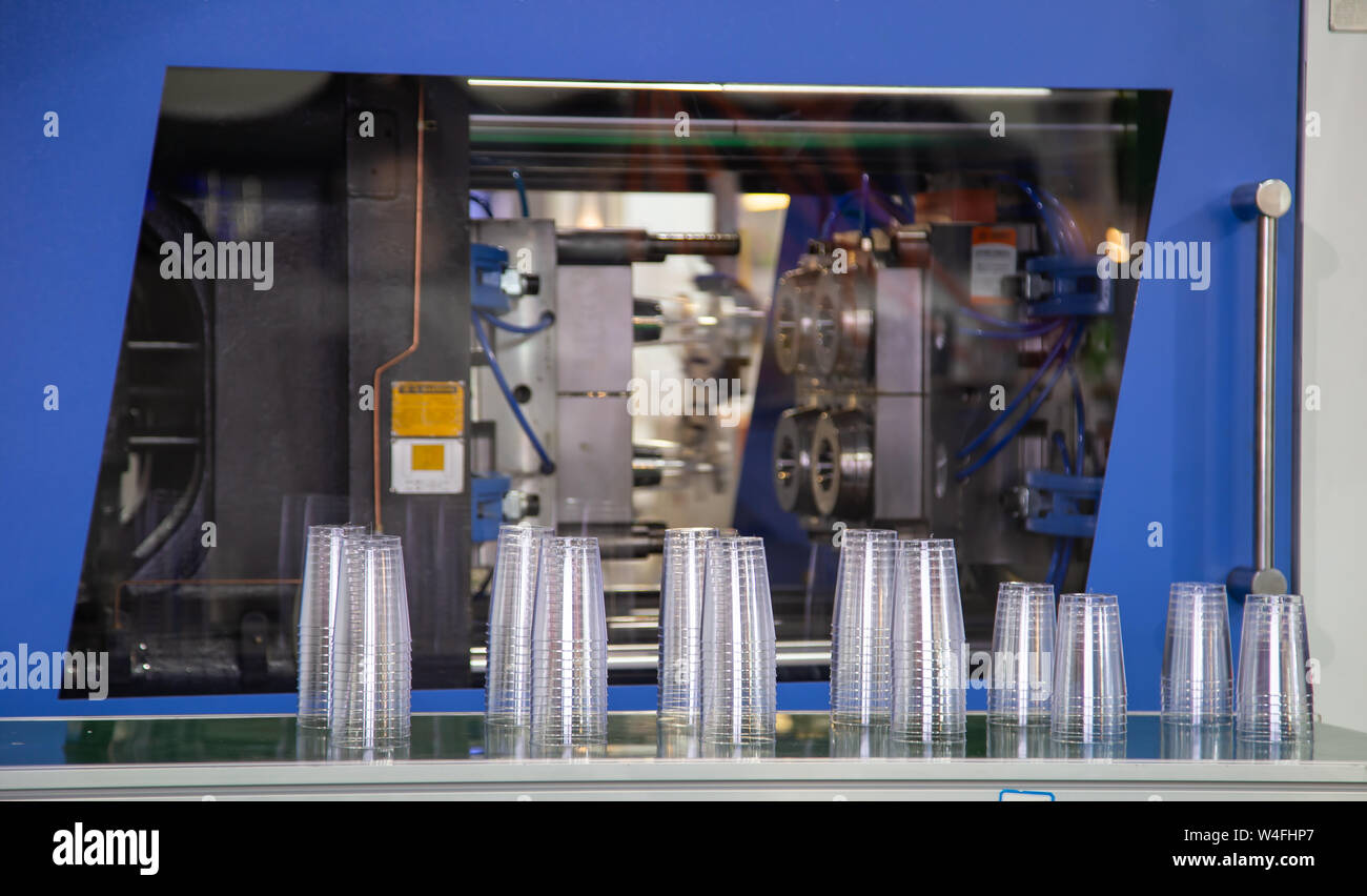 Disposable plastic cup product from plastic injection molding press ...