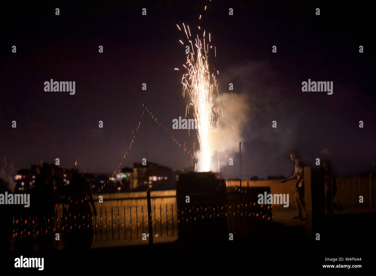 Indian Boy burning fire crackers on Diwali, Sahapur jat Delhi, 26 ...