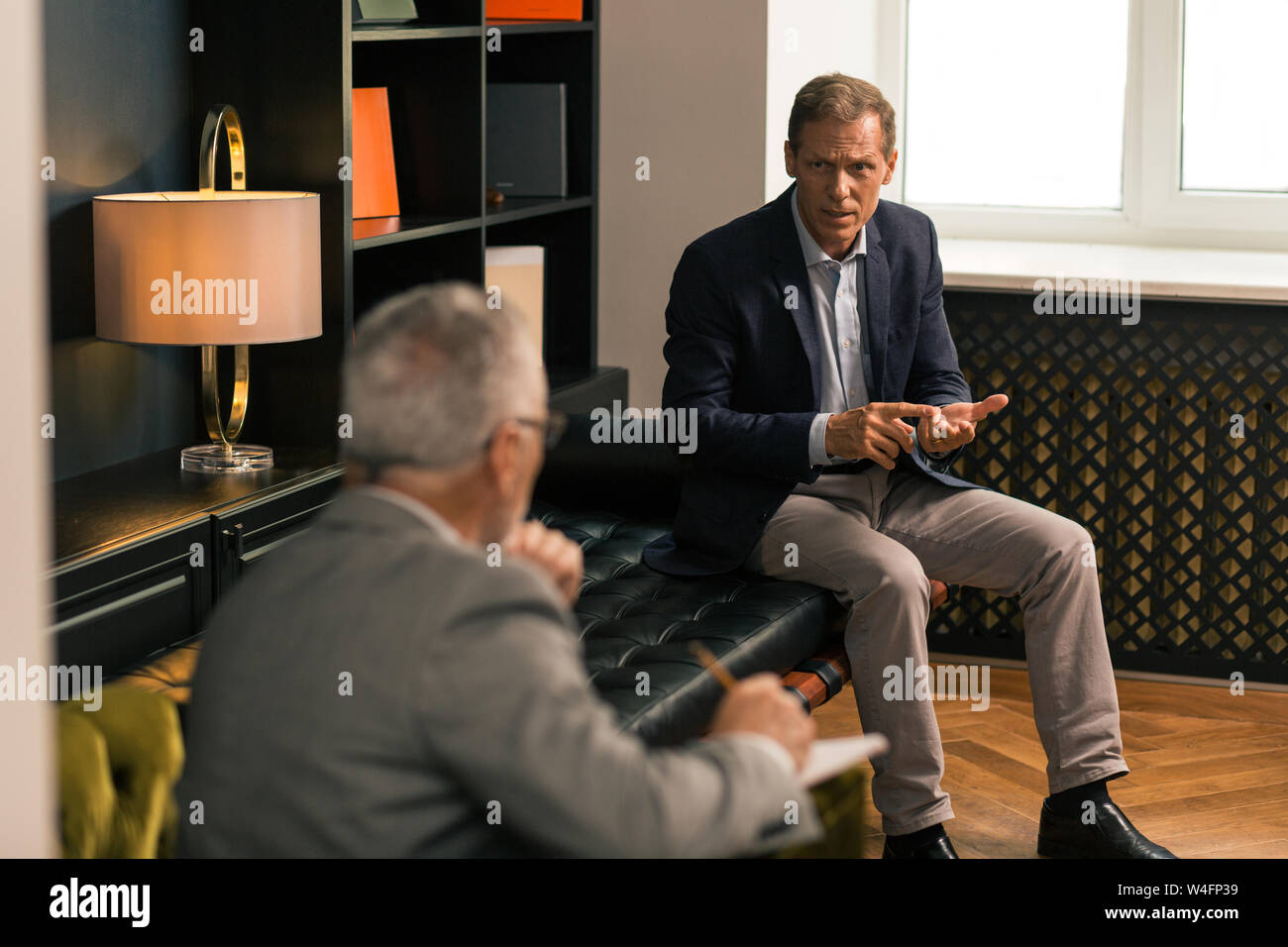 Telling discussing hi-res stock photography and images - Alamy