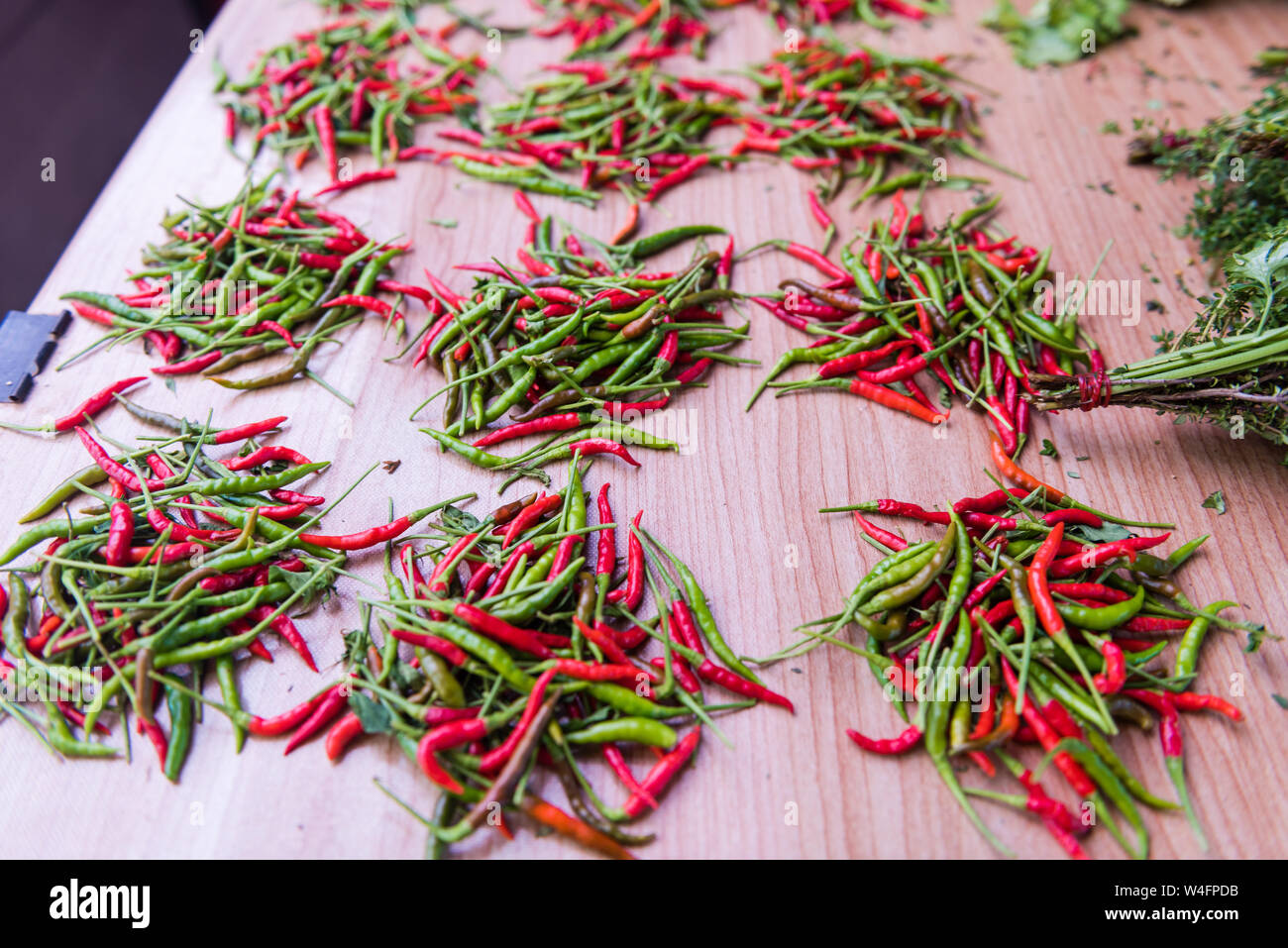 Bunches of red chilli peppers for sale from a street market stall Stock ...