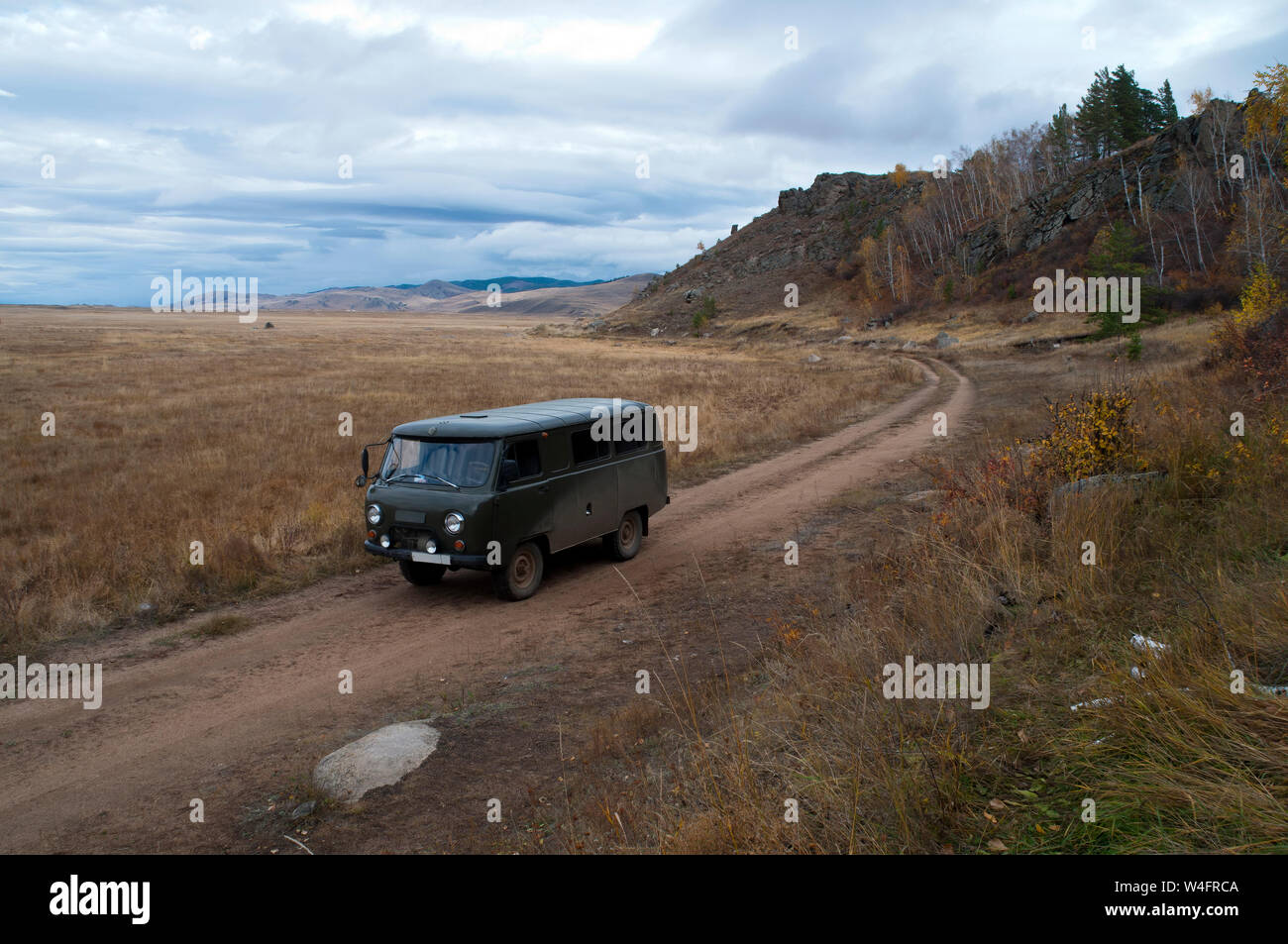 Barguzin Valley Russia, Russian off-road van on remote valley road ...