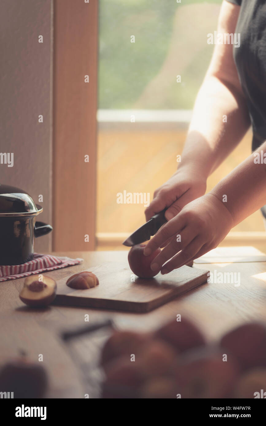 Woman making jam in kitchen hi-res stock photography and images - Alamy