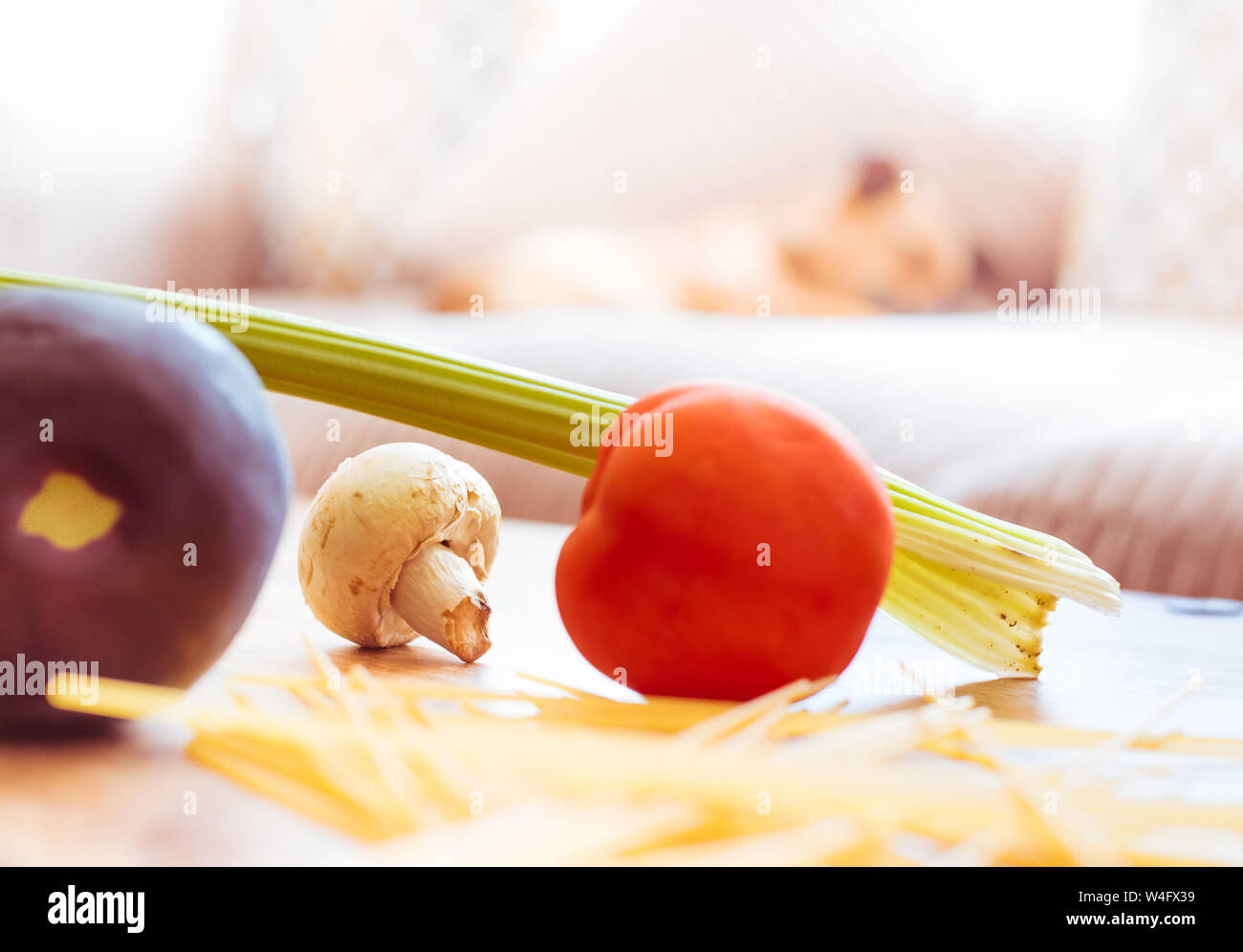 Spaghetti pasta and fresh vegetables on blurred background Stock Photo ...