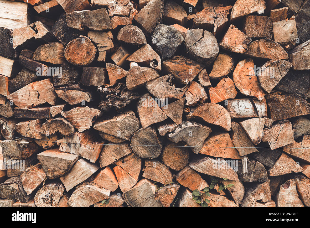 Stacked wooden logs, chopped firewood heap as background Stock Photo ...