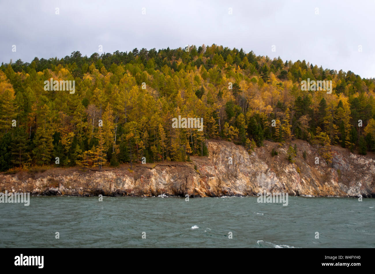 Lake Baikal Russia, shoreline along Chivyrkuysky Bay with autumn colors ...