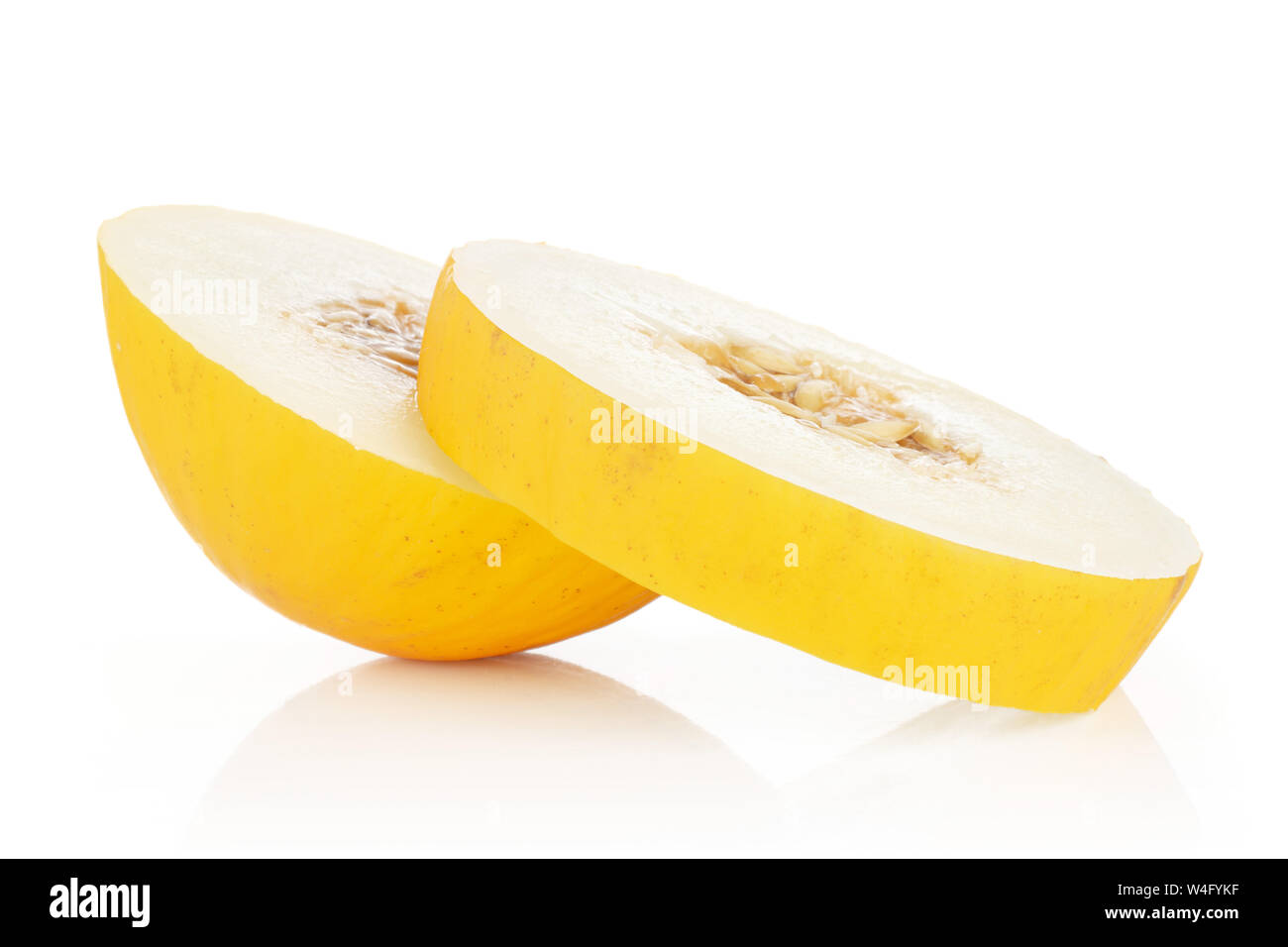 Group of two slices of fresh yellow melon canary isolated on white ...