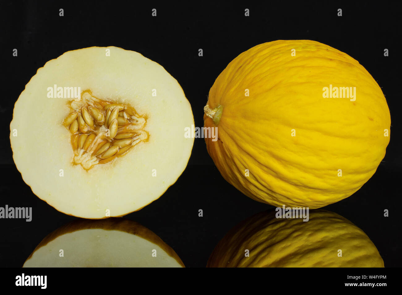 Group of one whole one half of fresh yellow melon canary cross section ...