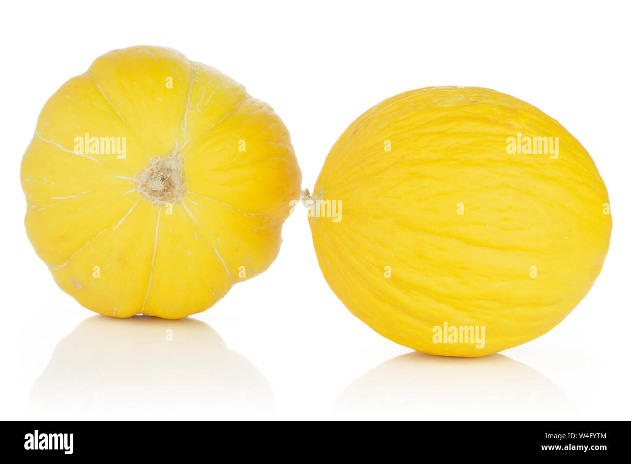 Group of two whole fresh yellow melon canary isolated on white ...