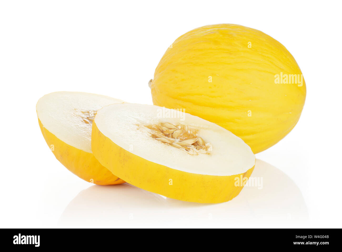 Group of one whole two slices of bright fresh yellow melon canary ...