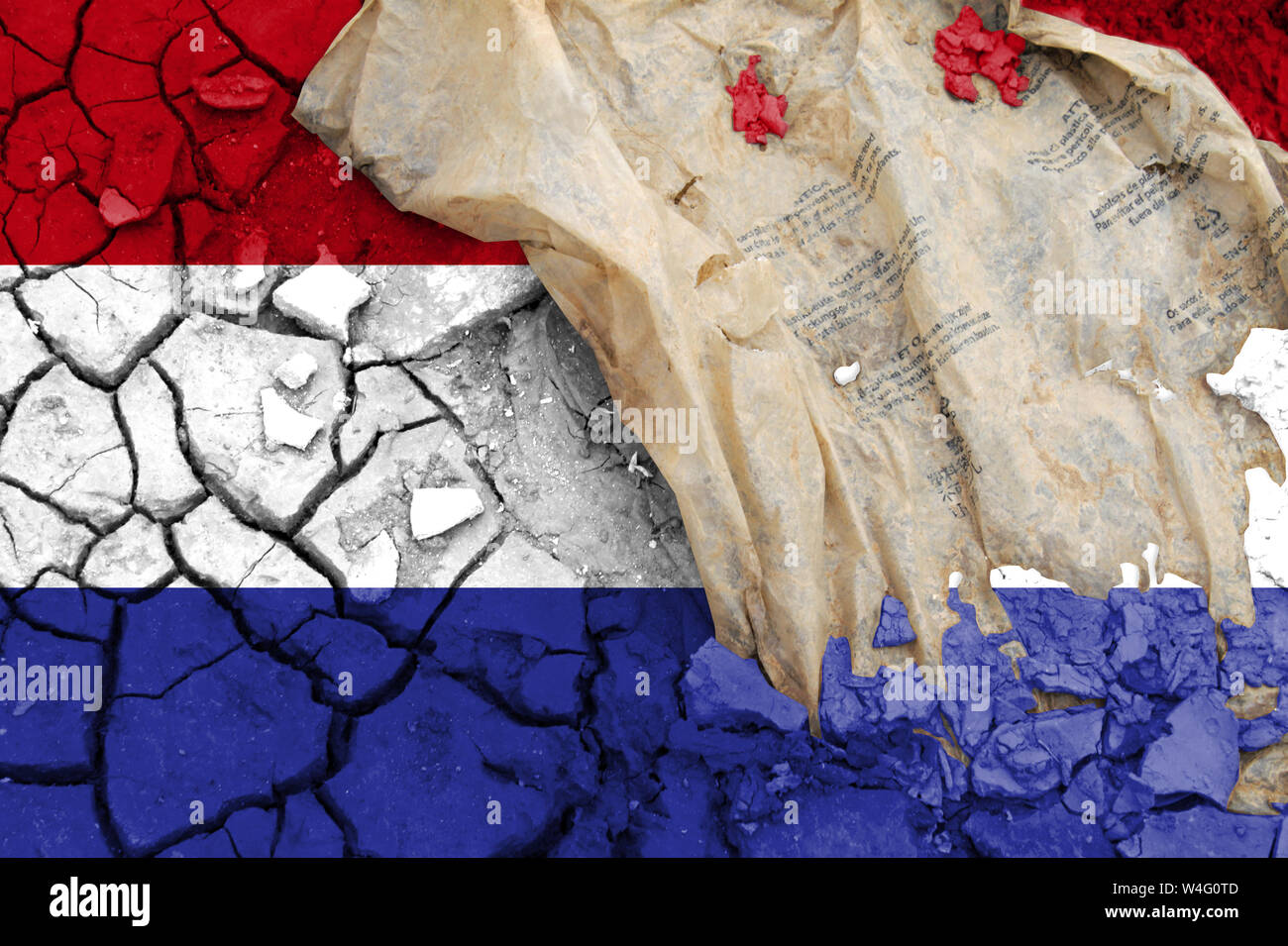 The flag of Netherlands, the flag is depicted on cracked earth. Ecology ...