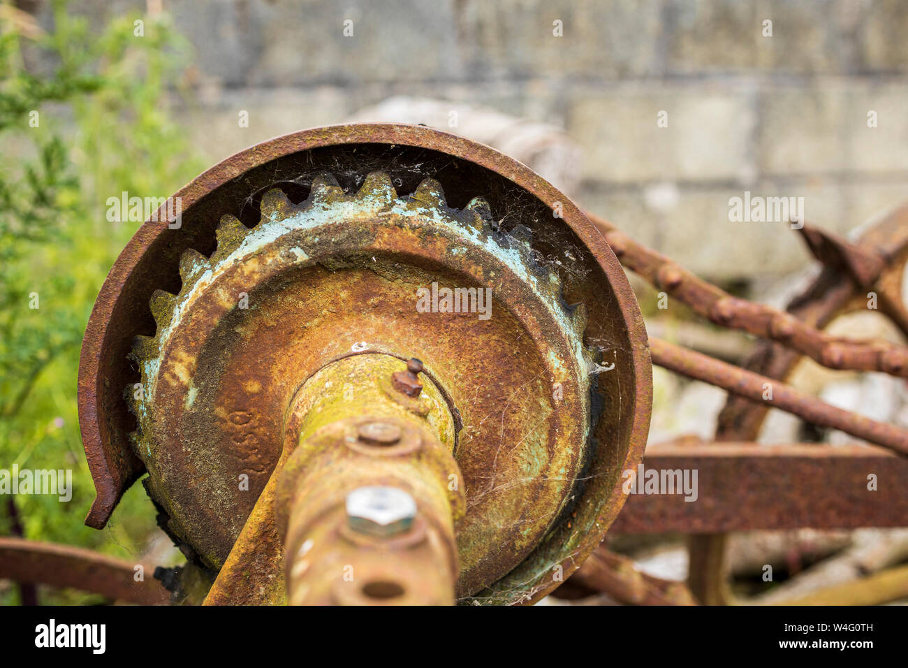 Abandoned Blackstone Digger gear wheel detail, farm machine rusting on ...