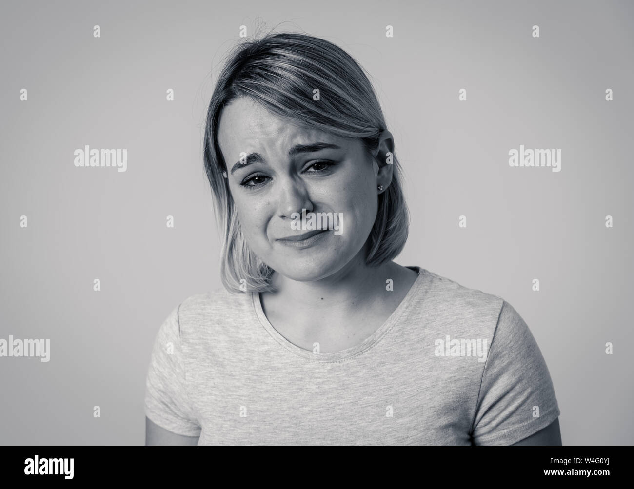 Black and white portrait of young sad and depressed woman, crying ...