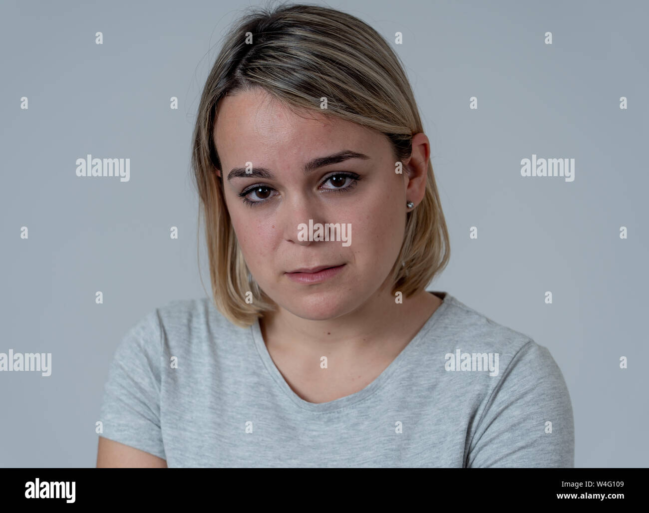 Woman gesture looking down face hi-res stock photography and images - Alamy