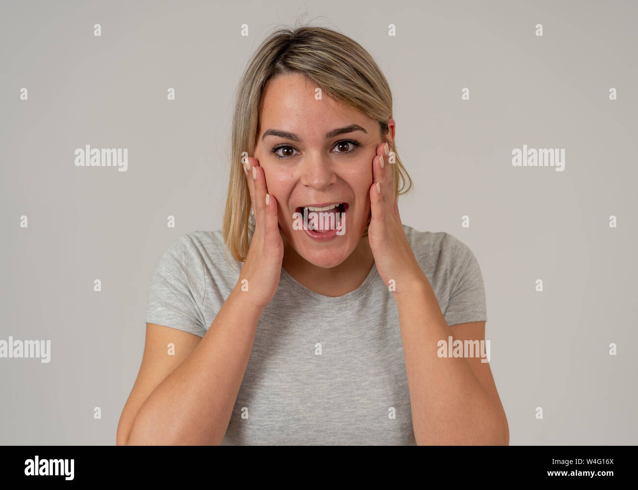 Portrait of beautiful shocked woman winning the lottery or having great ...