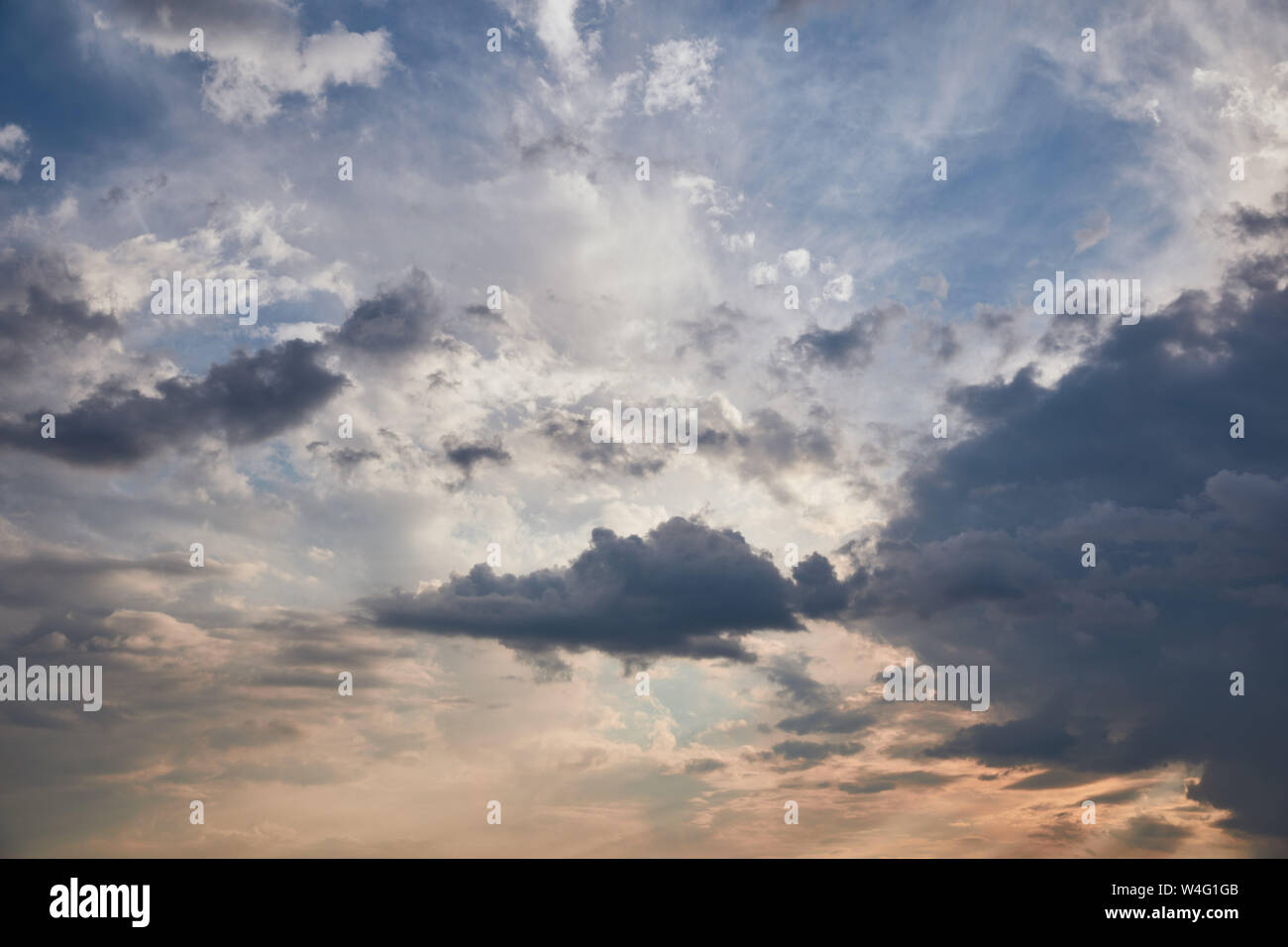 dark clouds on blue sunlight sky background Stock Photo - Alamy