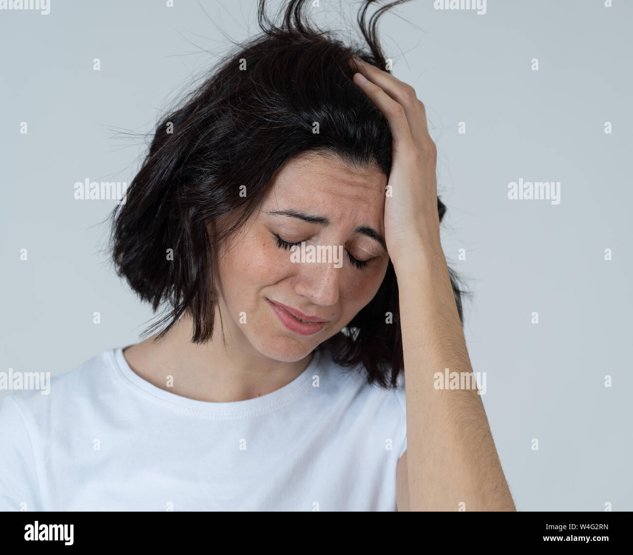 Close up portrait of sad latin woman serious and concerned, looking ...