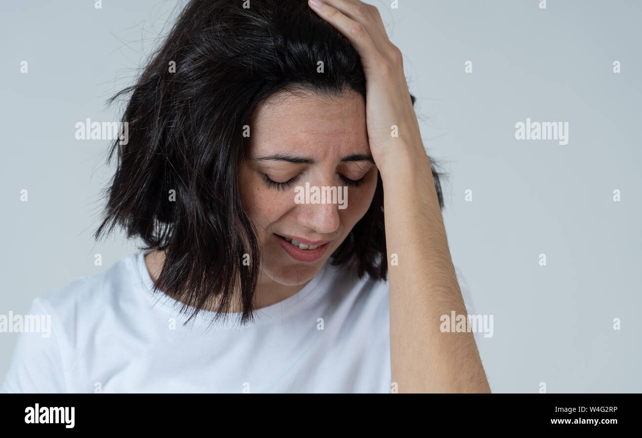 Close up portrait of sad latin woman serious and concerned, looking ...