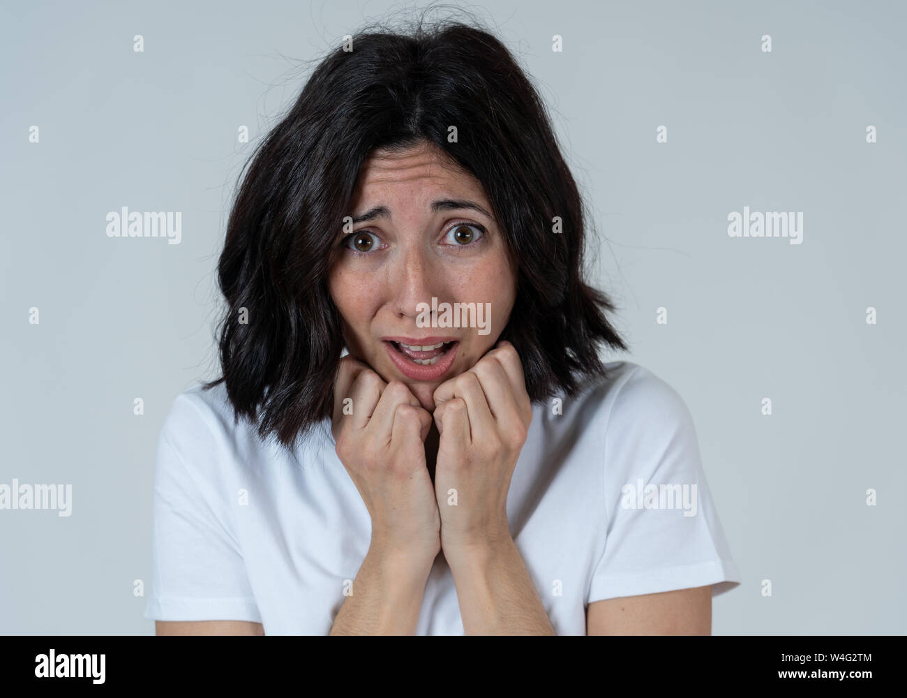 Close up of young woman with frightened eyes, shocked making fear ...