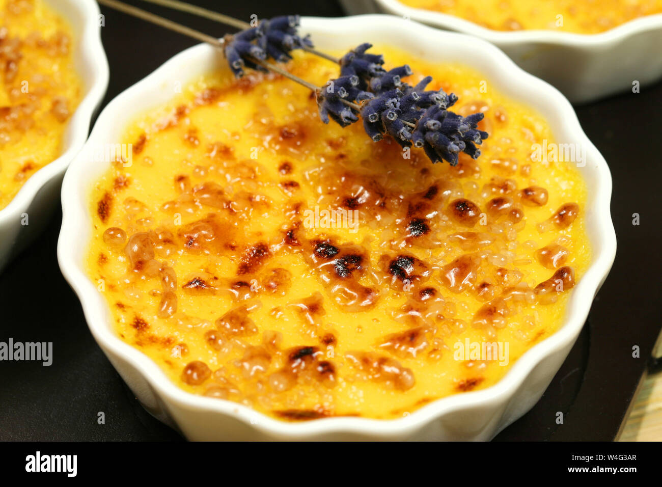 Creme brulee with lavender flowers Stock Photo - Alamy