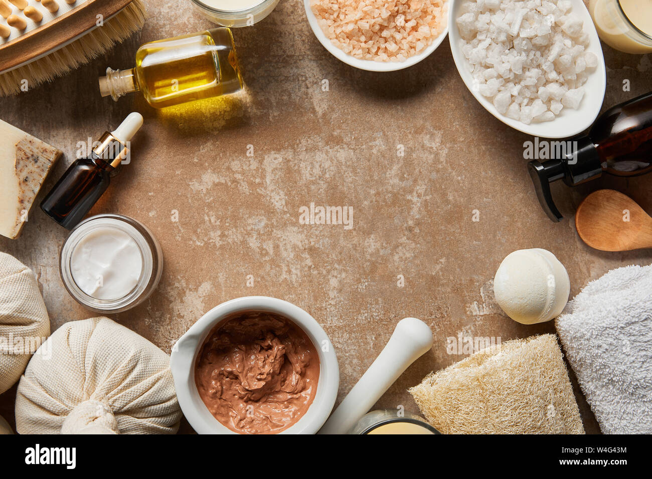 top view of natural cosmetics on textured weathered beige surface Stock ...