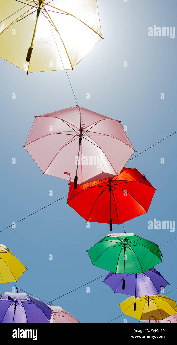 Brightly coloured umbrellas hi-res stock photography and images - Alamy