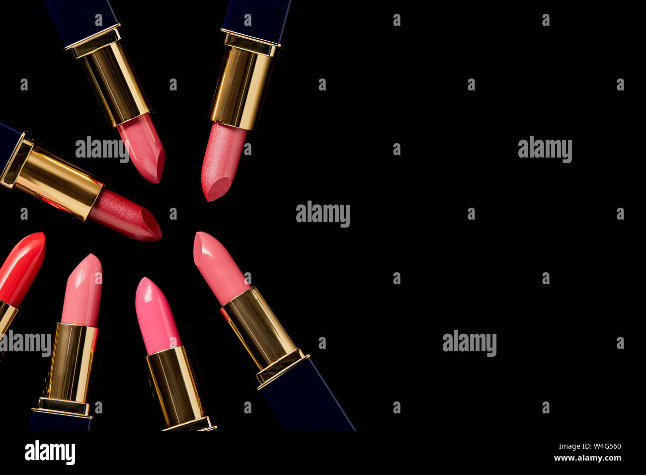top view of various shades of lipsticks isolated on black with copy ...