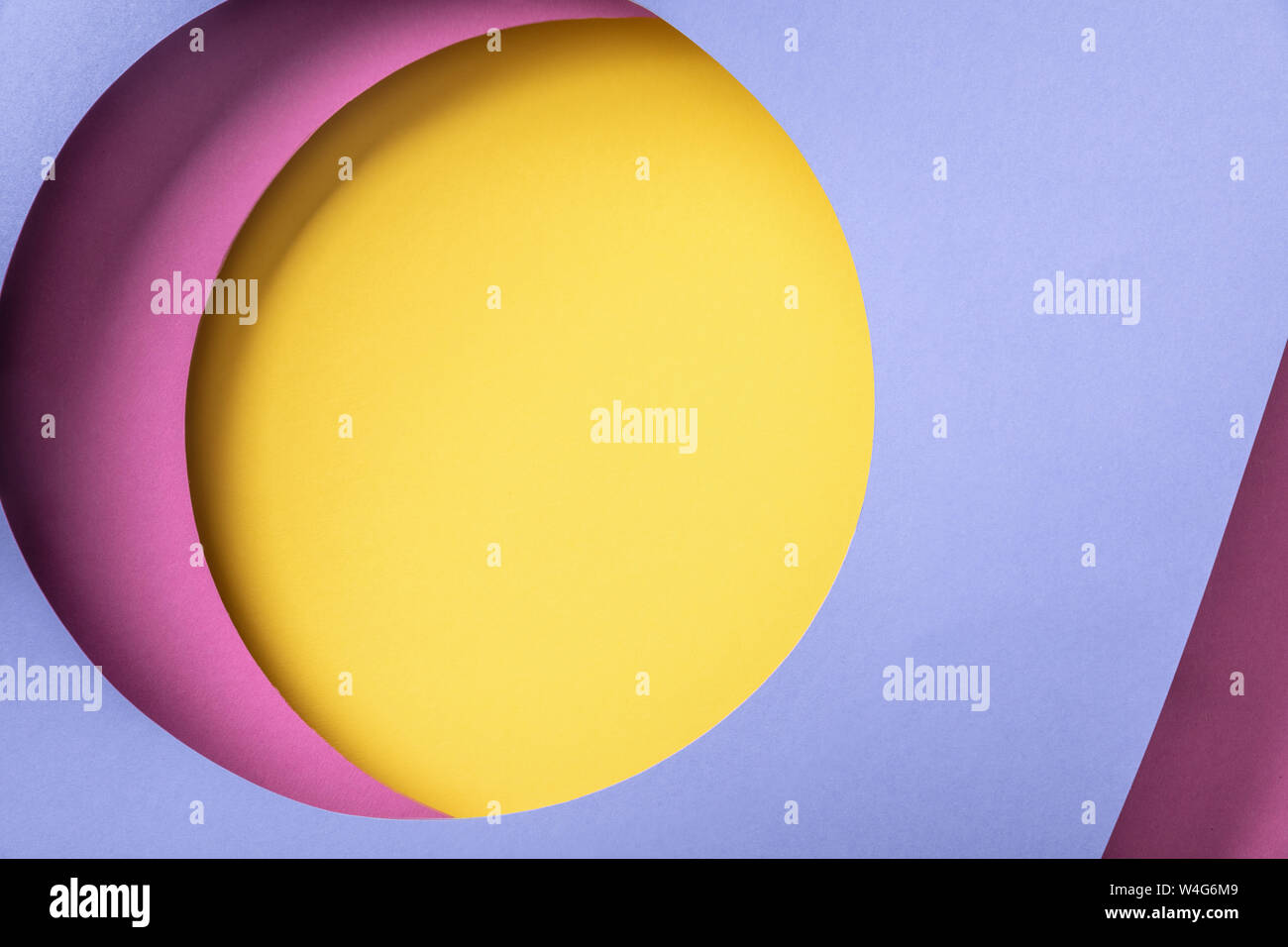 creative paper background with bright colorful holes Stock Photo - Alamy