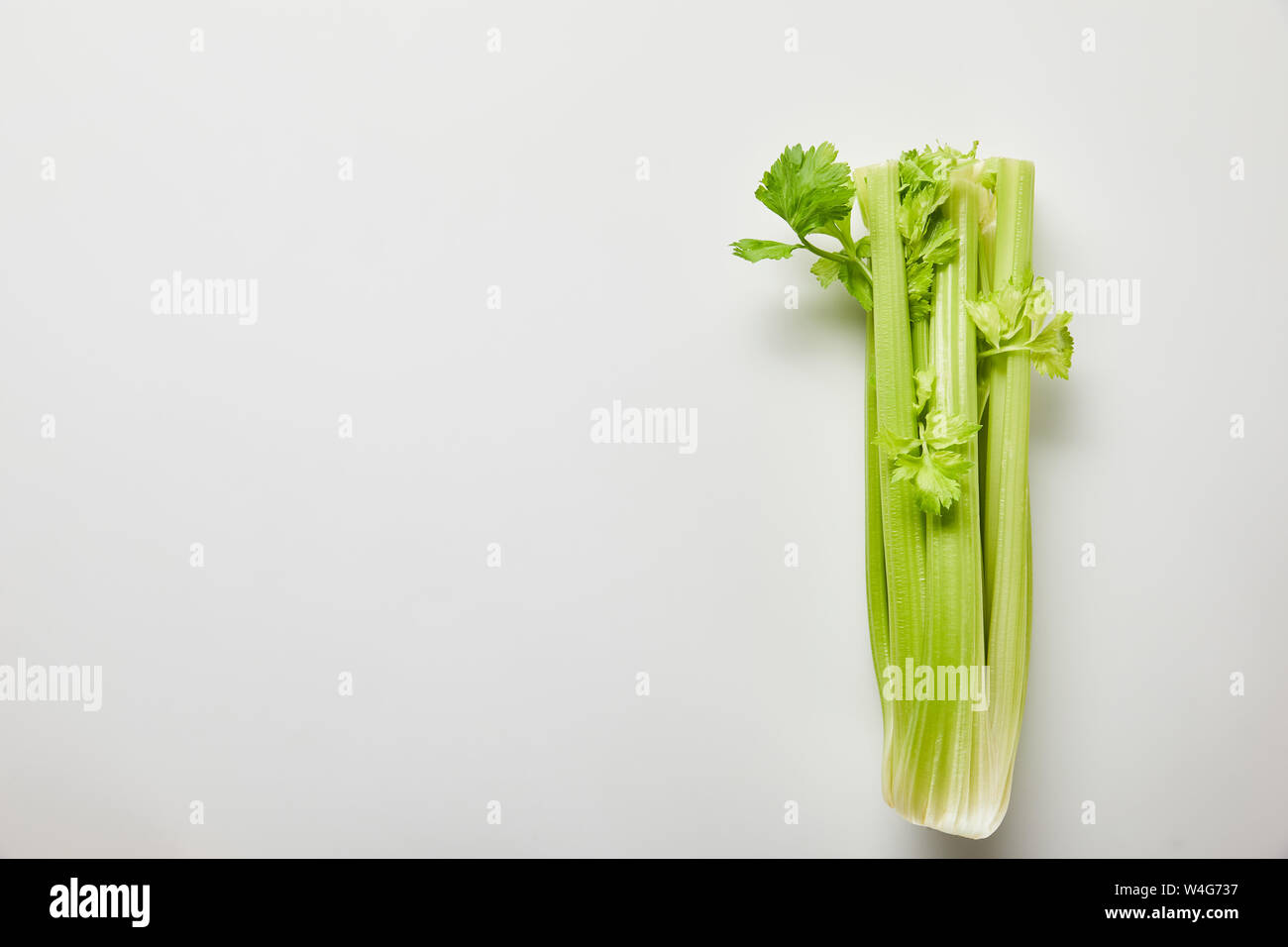 top view of green leek on white background Stock Photo - Alamy