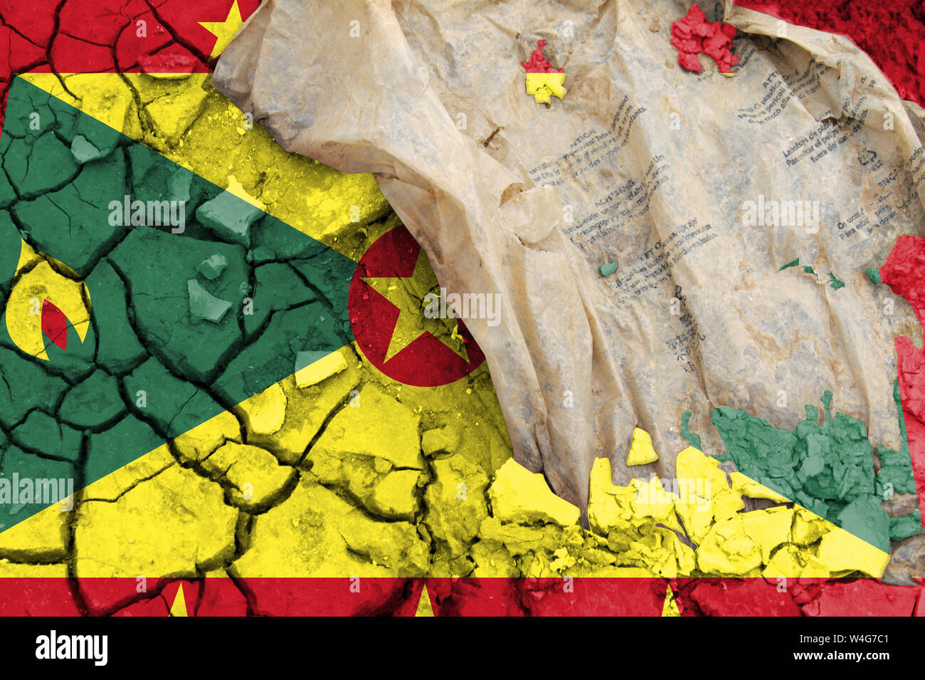 The flag of Grenada, the flag is depicted on cracked earth. Ecology ...