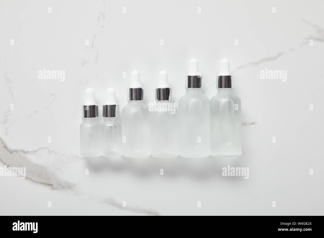 Cosmetic glass bottles on hi-res stock photography and images - Alamy