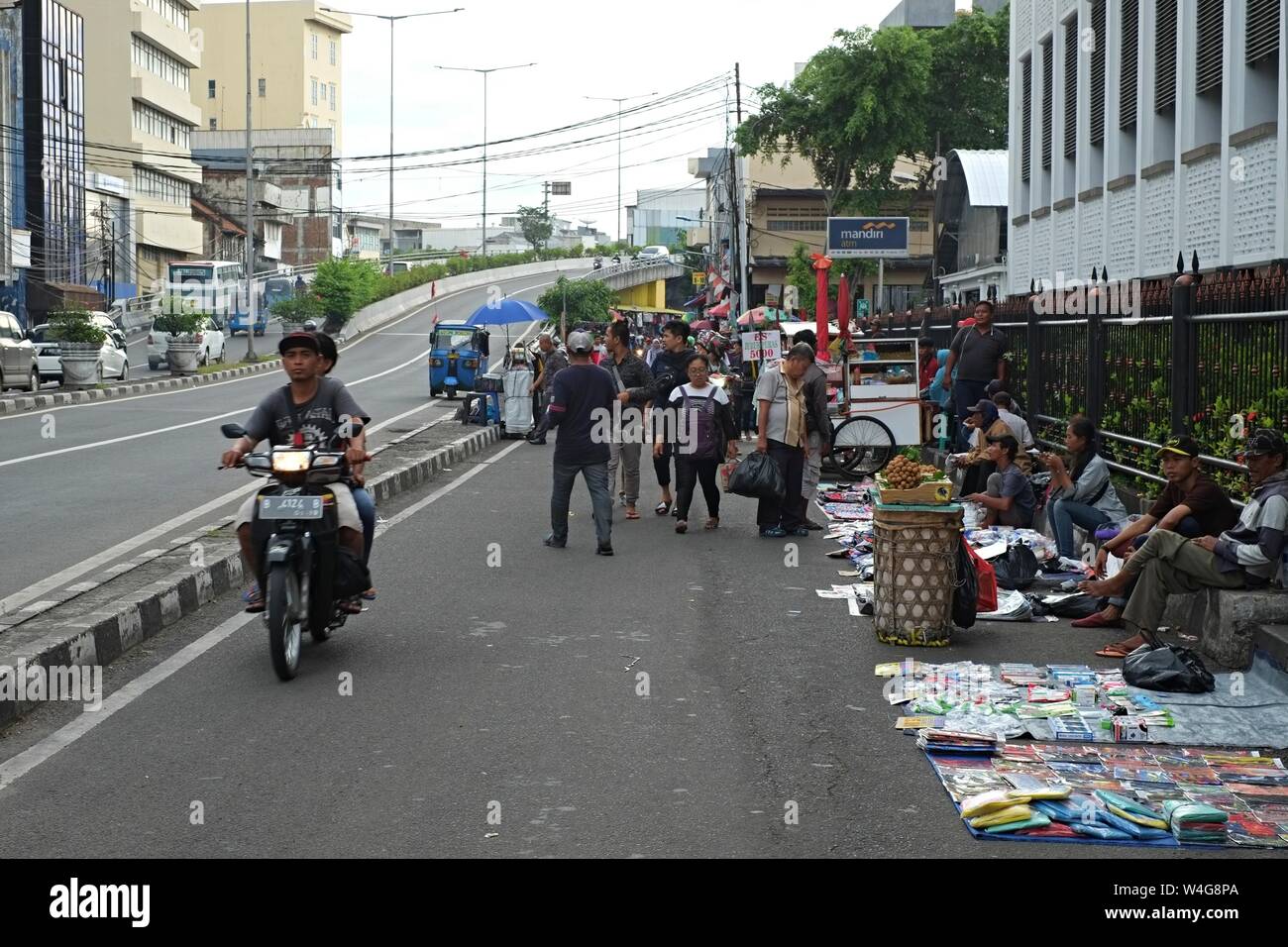 Jakarta, Indonesia - June 2019 : A view of a street with motorcycle and ...
