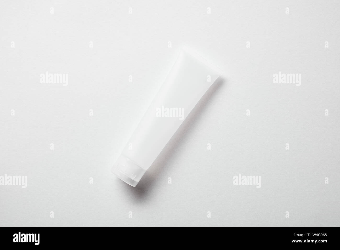 top view of empty cream tube on white Stock Photo - Alamy