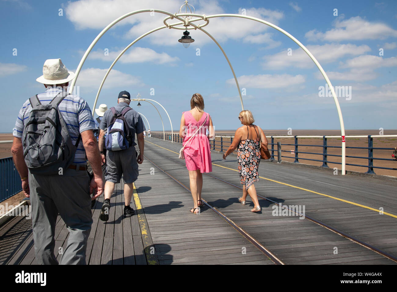 Tourist woman strolling along promenade hi-res stock photography and ...