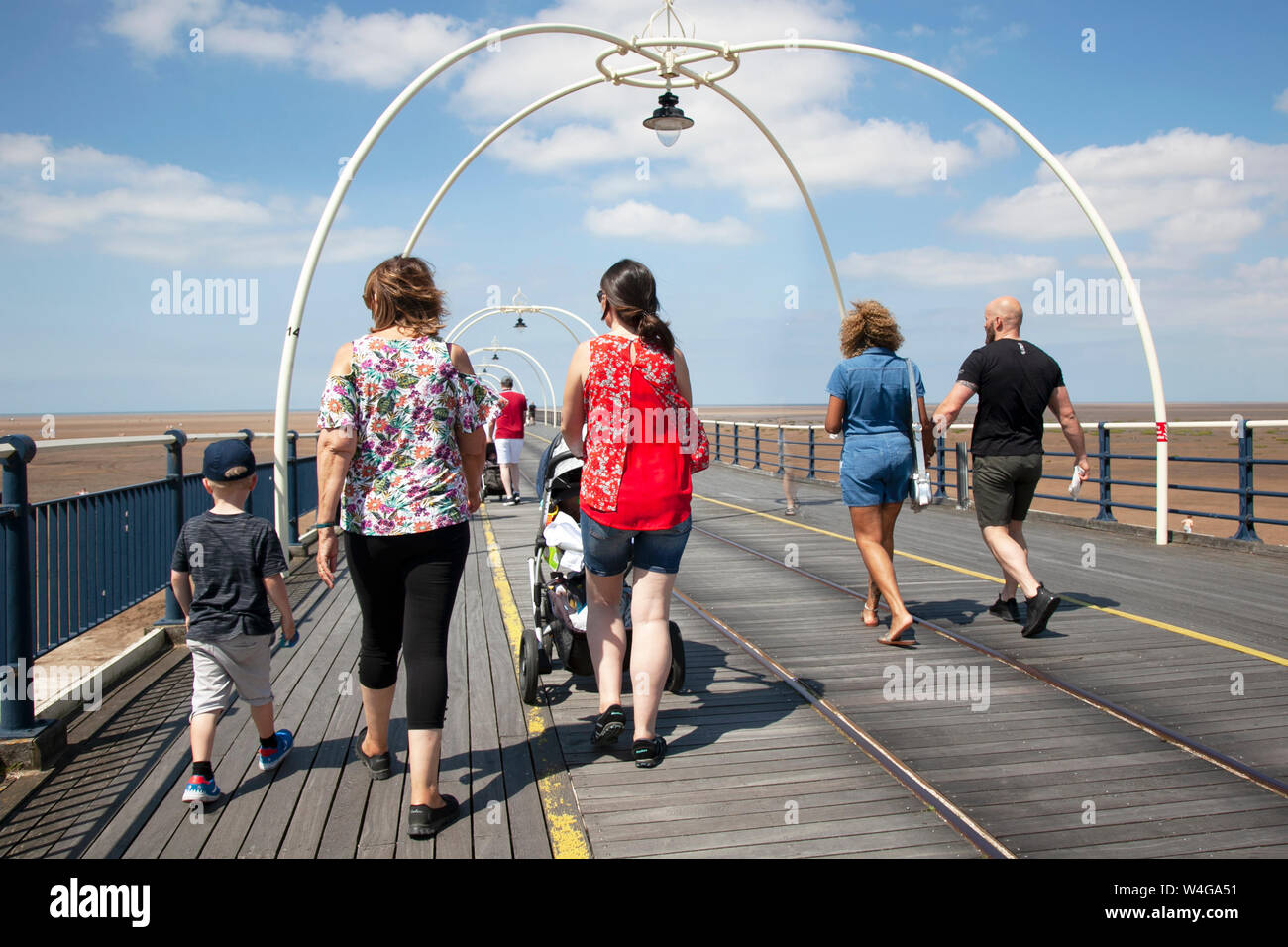 Tourist woman strolling along promenade hi-res stock photography and ...
