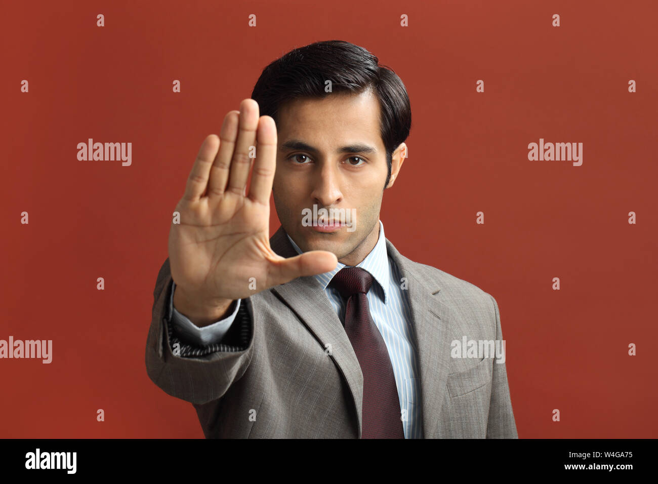 Businessman making stop gesture sign Stock Photo - Alamy