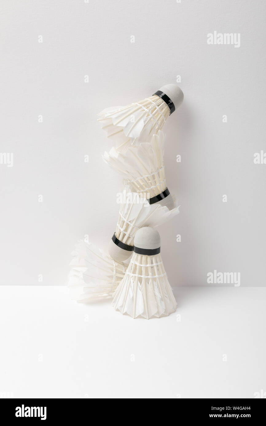white badminton shuttlecocks in pile on white background Stock Photo ...