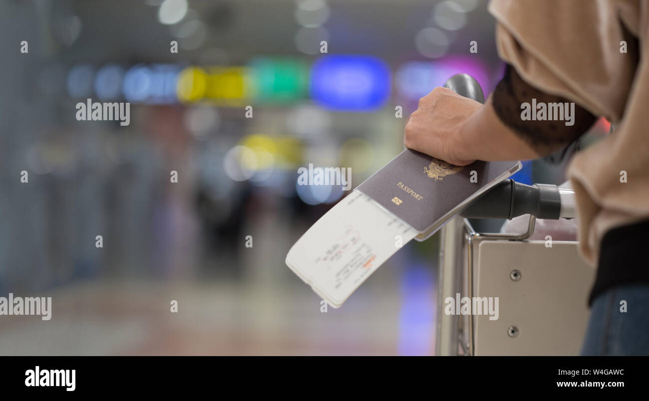 Closeup of girl holding passports and boarding pass at airport Stock ...